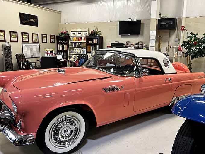 That coral pink convertible with whitewall tires is pure 1950s optimism, ready for a malt shop run.