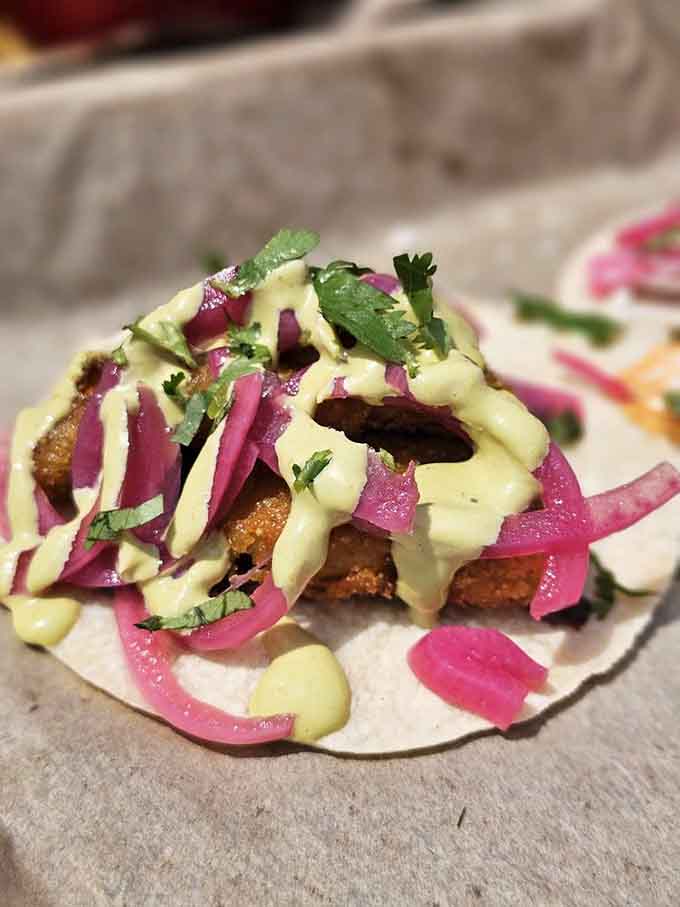 Fried avocado might sound indulgent, but with those pickled onions and creamy drizzle, it's absolutely worth it.