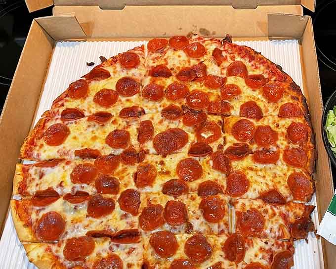 This pepperoni pizza looks like someone played connect-the-dots with deliciousness and absolutely nailed the assignment.