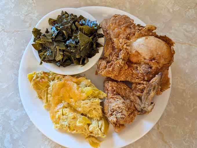 Golden fried chicken with collard greens and squash casserole&mdash;this is what comfort looks like on a plate.