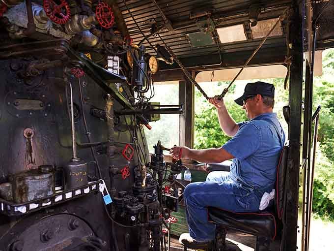 Inside the steam cab, levers and gauges create a symphony of mechanical poetry that engineers have mastered.
