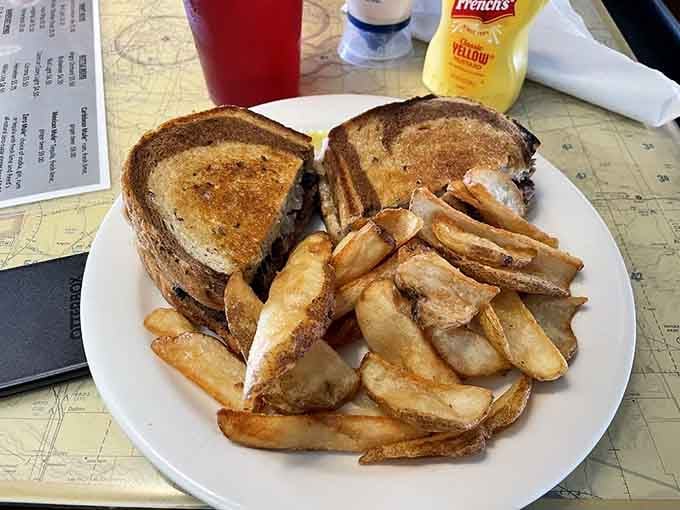The Patty Melt arrives with perfectly golden fries, making you wonder why anyone bothers with airplane food anymore.