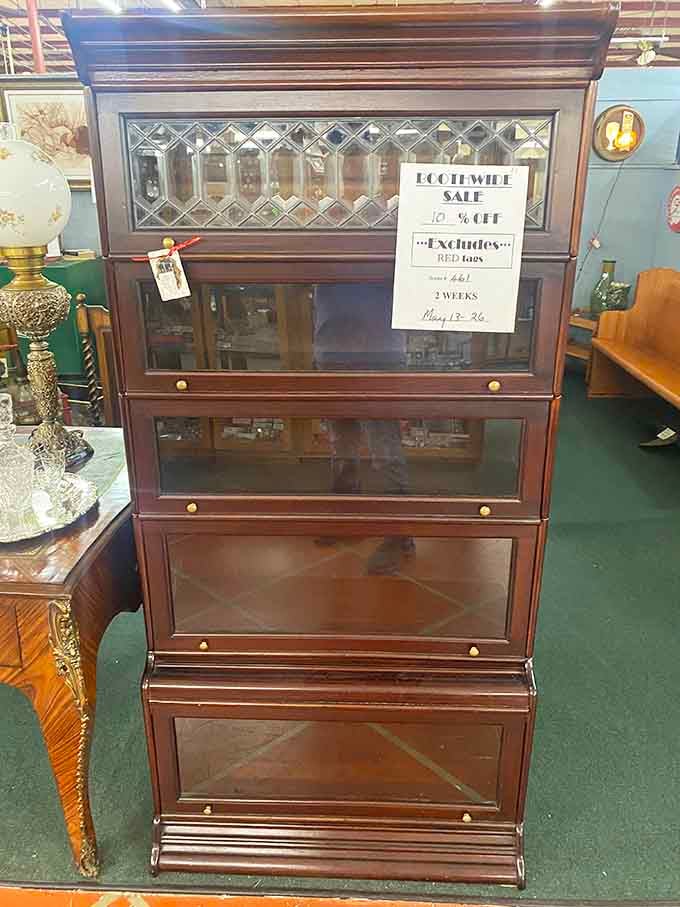 This elegant barrister bookcase with beveled glass doors belongs in a lawyer's office from a black-and-white movie.