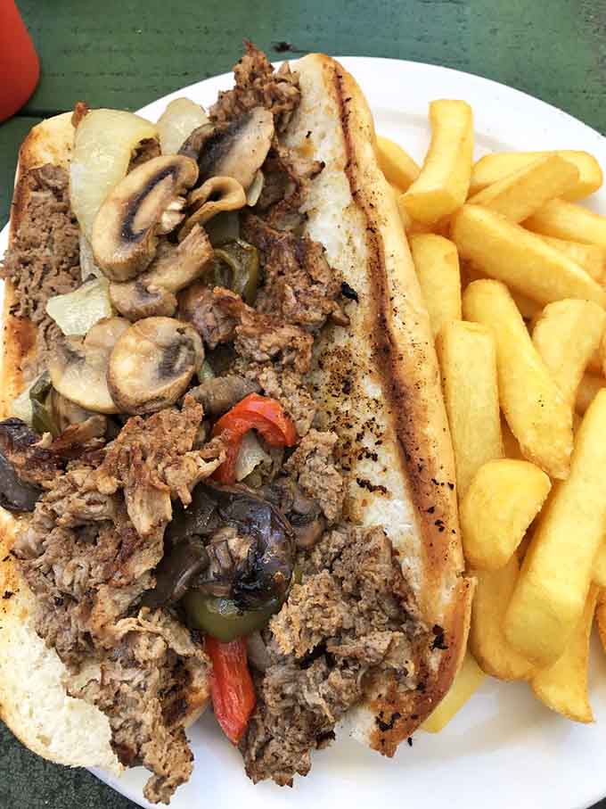 This Philly cheesesteak loaded with peppers, onions, and mushrooms could make Rocky Balboa weep with patriotic joy.