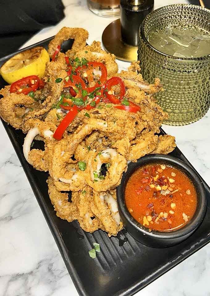 Golden, crispy calamari that proves sometimes the classics become classics for very good reasons worth celebrating repeatedly.