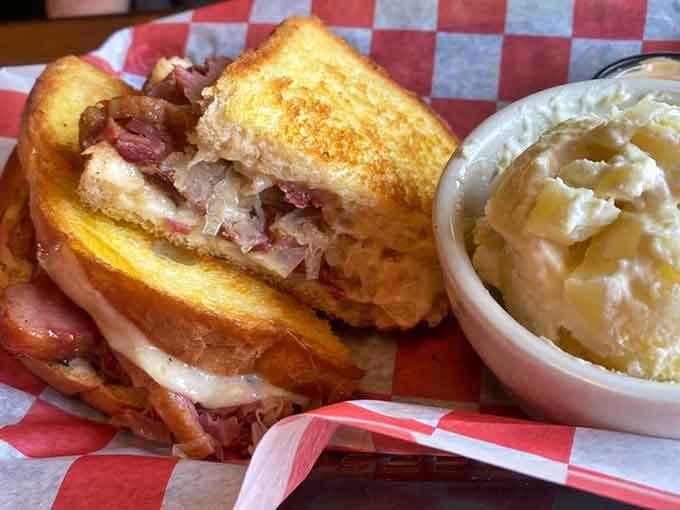 The Reuben arrives with enough corned beef to make your cardiologist schedule a follow-up appointment immediately.
