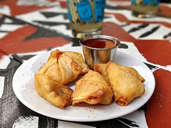 Golden crab rangoons that prove cream cheese and crab is a combination the universe got absolutely right.