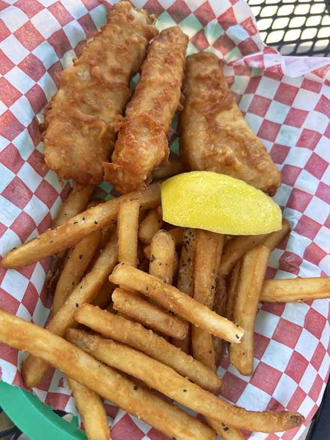 That's not just fried fish, that's a masterclass in crispy perfection paired with fries that deserve their own fan club.