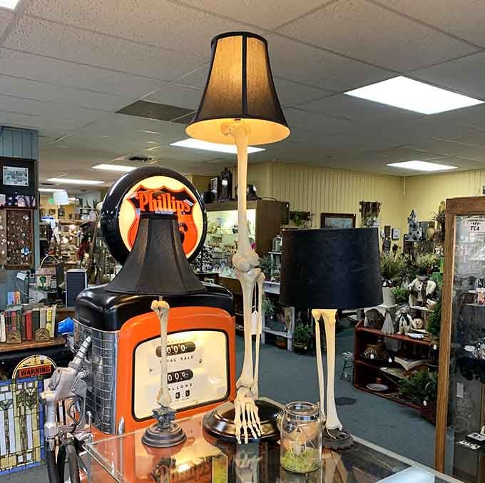 That vintage Phillips 66 gas pump lamp proves even skeletons appreciate good lighting and nostalgic Americana vibes.