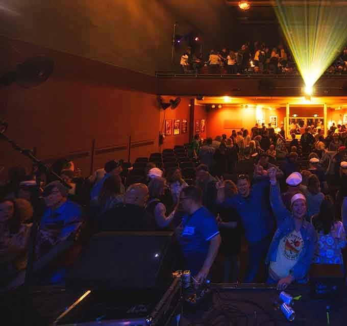 The view from your seat reveals a stage ready for magic, complete with instruments waiting to create memorable moments.