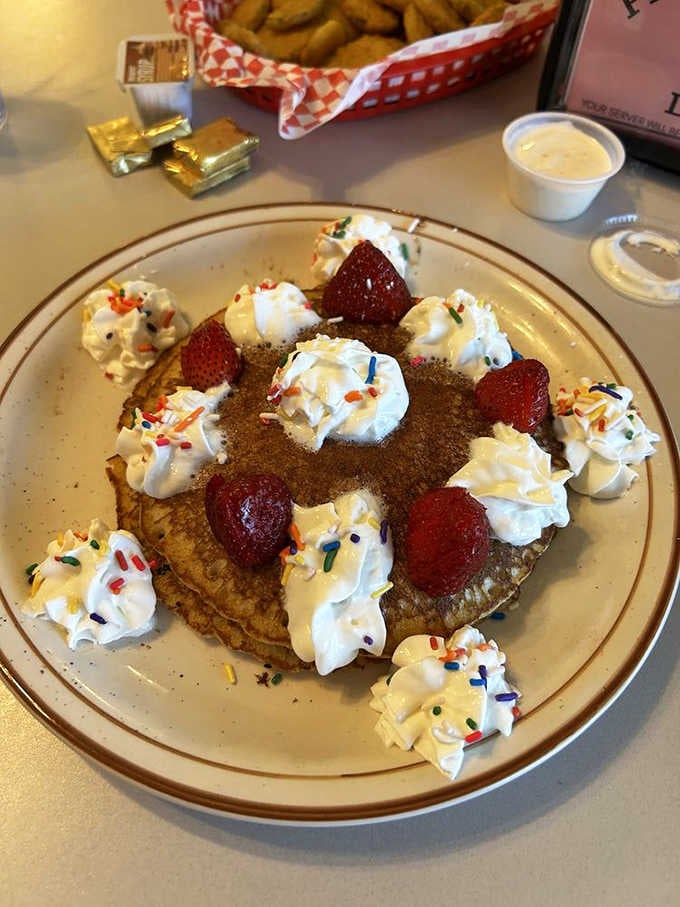 Pancakes decorated like a birthday cake because apparently someone decided breakfast should also be a celebration, and they were right.