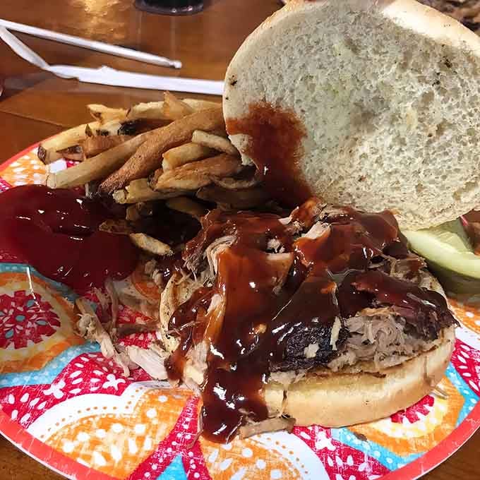 Pulled pork piled high on a bun, proving that sometimes the simplest things are absolutely perfect.