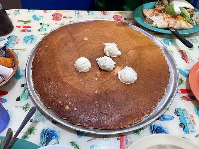 This golden disc of breakfast ambition comes with butter pats that look adorably tiny by comparison.