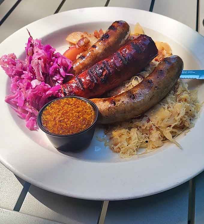 Three glorious sausages with all the fixings. This plate understands the assignment and deserves extra credit.