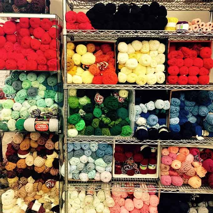 A rainbow of yarn organized by color, because sometimes the hardest part of crafting is choosing your palette.
