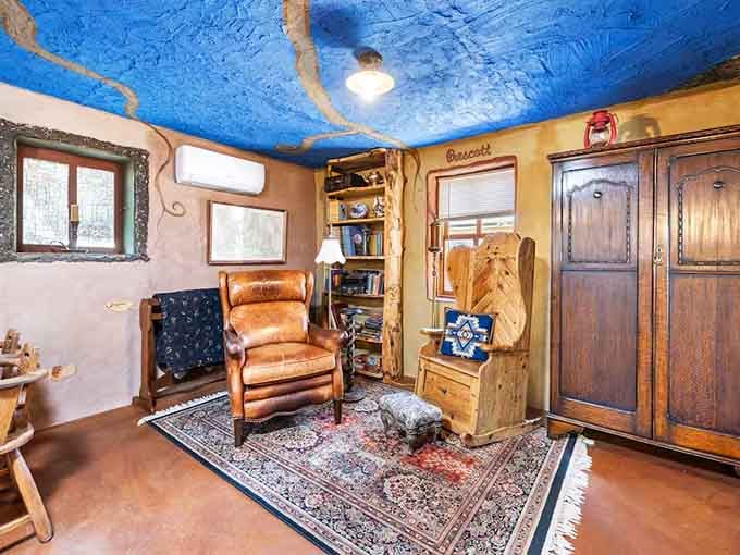 A blue ceiling mimics the sky in this cozy corner perfect for pondering your next quest.