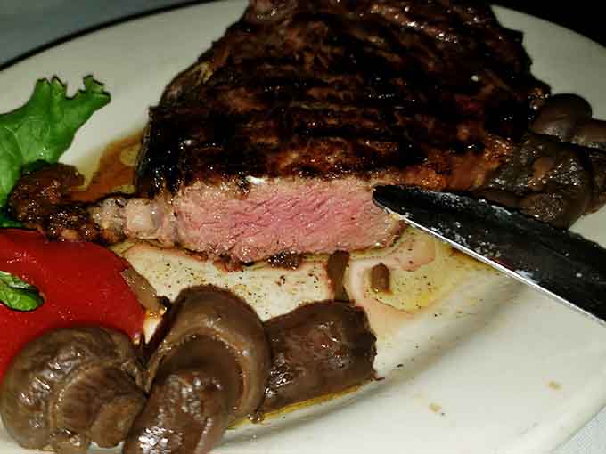 Medium-rare perfection sliced to reveal that pink center&mdash;this is what steak dreams are made of, folks.