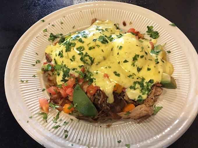 Eggs Benedict draped in hollandaise that would make Julia Child nod approvingly, perched atop perfectly toasted bread.