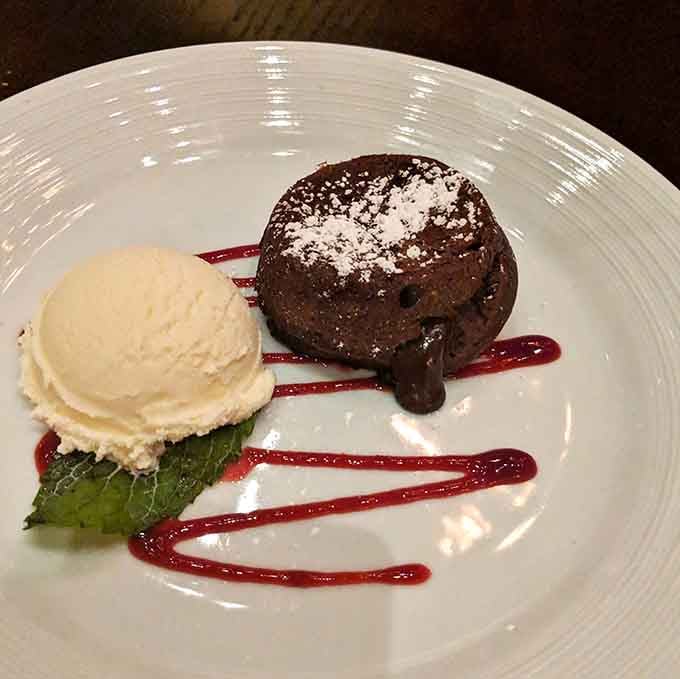 Molten chocolate cake with ice cream, because sometimes lava needs a cooling-off period before consumption.