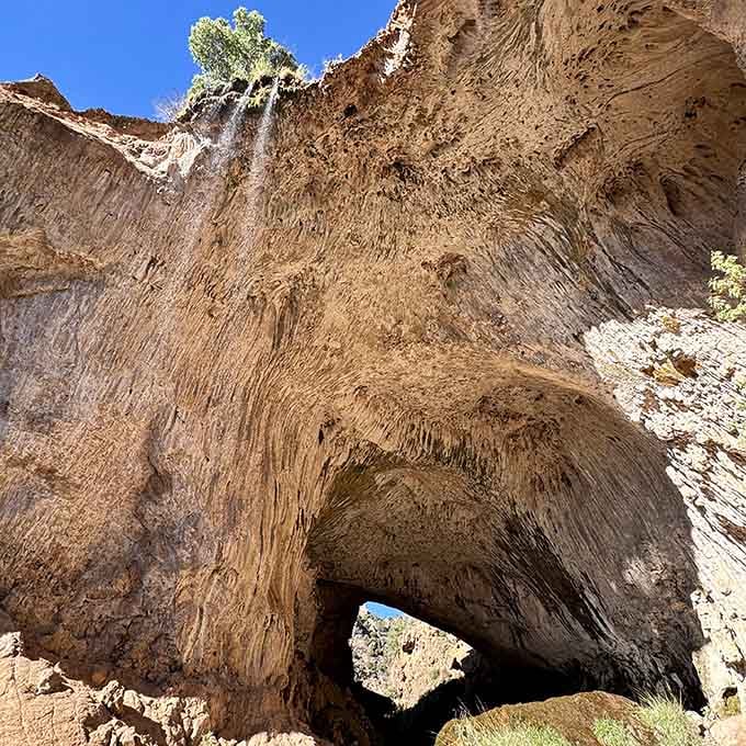 Those layered travertine walls tell stories spanning thousands of years, each stripe a chapter in geological history.