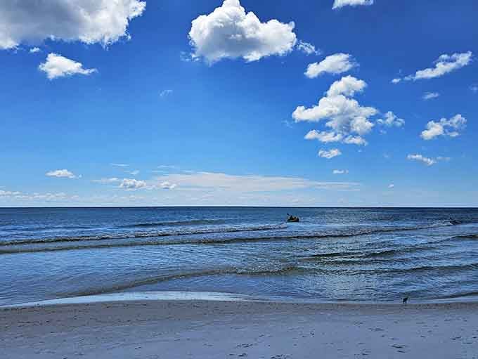 Gentle surf and powder-soft sand create the kind of beach day that makes you forget your phone exists.