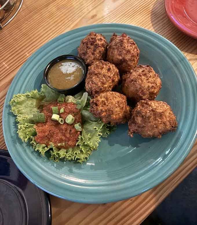 Golden conch fritters that prove the Caribbean knows exactly what it's doing with seafood and spices.