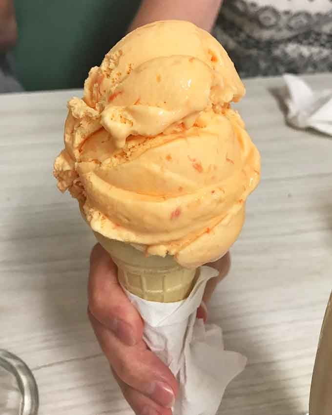 Three perfect scoops stacked like edible architecture, proving that engineering degrees aren't always necessary for greatness.