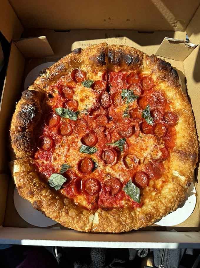 Cup and char pepperoni creating little pools of flavor on a perfectly blistered crust is basically pizza engineering at its finest.