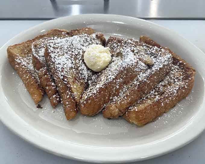 French toast dusted with powdered sugar like fresh snow, because sometimes breakfast needs to look as good as it tastes.