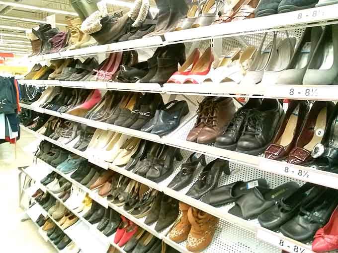 Rows of shoes that have walked different paths, now ready to carry new journeys at bargain-basement prices.