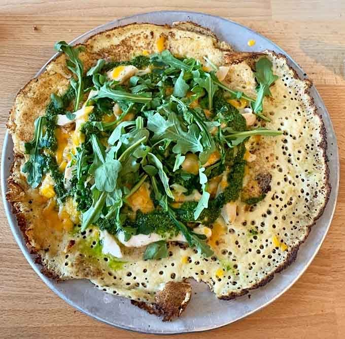 That savory pancake topped with greens and cheese looks like edible art, which seems fitting given the restaurant's artistic namesake.