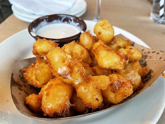 Golden, crispy cheese curds with Red Hot blue cheese dipping sauce: Wisconsin's gift to Michigan diners.