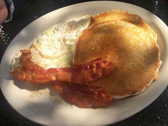 Golden pancakes and perfectly crisped bacon create the kind of breakfast plate that makes mornings worth celebrating.
