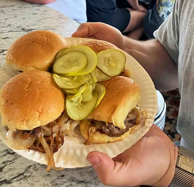 These sliders come loaded with pickles because sometimes more is actually more, especially when it's this delicious.