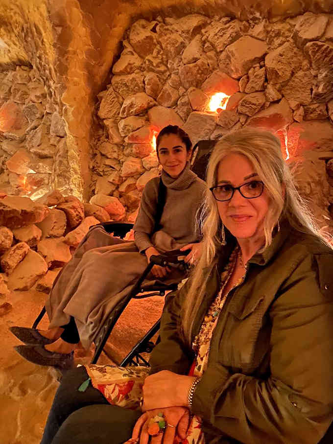 Two friends sharing the salt cave experience, proving wellness is always better when you bring good company along.