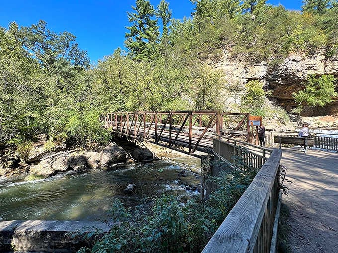 This footbridge over crystal-clear water proves that sometimes the journey really is better than the destination.