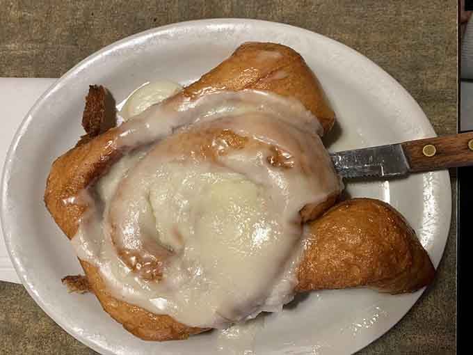 A cinnamon roll the size of your head, glazed to perfection, proving bigger really is better sometimes.