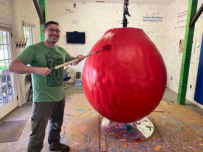 Armed with a brush and a grin, this visitor becomes part of a decades-long tradition of creative persistence.