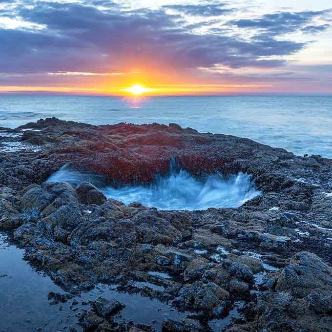 Thor's Well at sunset is nature's way of showing off, and honestly, we're not even mad about it.