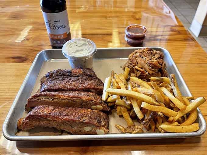 This is what barbecue heaven looks like on a tray: tender ribs, crispy fries, and sides worth writing home about.