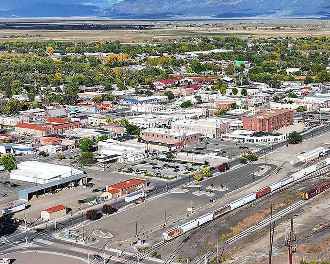 Small-town America from above&mdash;where the railroad still runs, the buildings tell stories, and mountains frame everything like nature's own picture postcard.