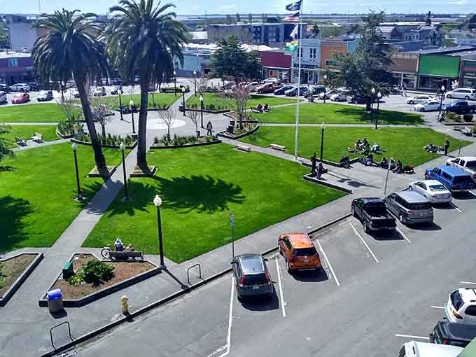 This vibrant town plaza proves that small-town charm and lush green spaces create the perfect gathering spot.