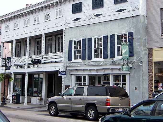 The weathered shutters and ornate trim on this building tell stories that would fill a dozen history books.