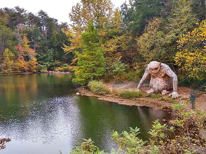 This gentle giant reaches toward the pond with wooden fingers, blending art and nature into pure magic.