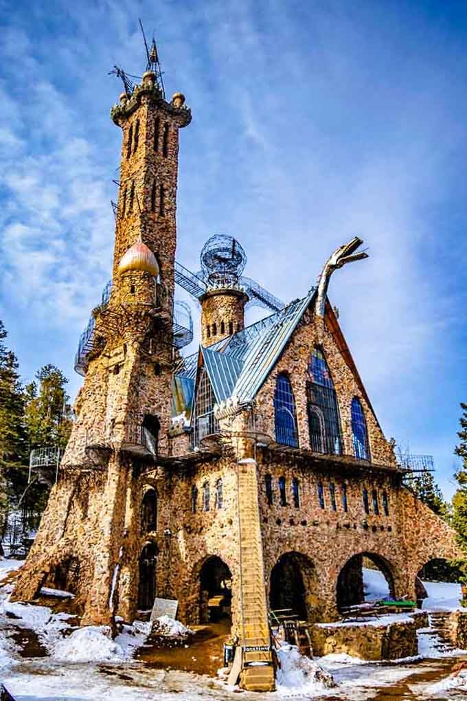 This handmade castle rises like something from a fantasy novel, complete with dragons and dreams built stone by stone.