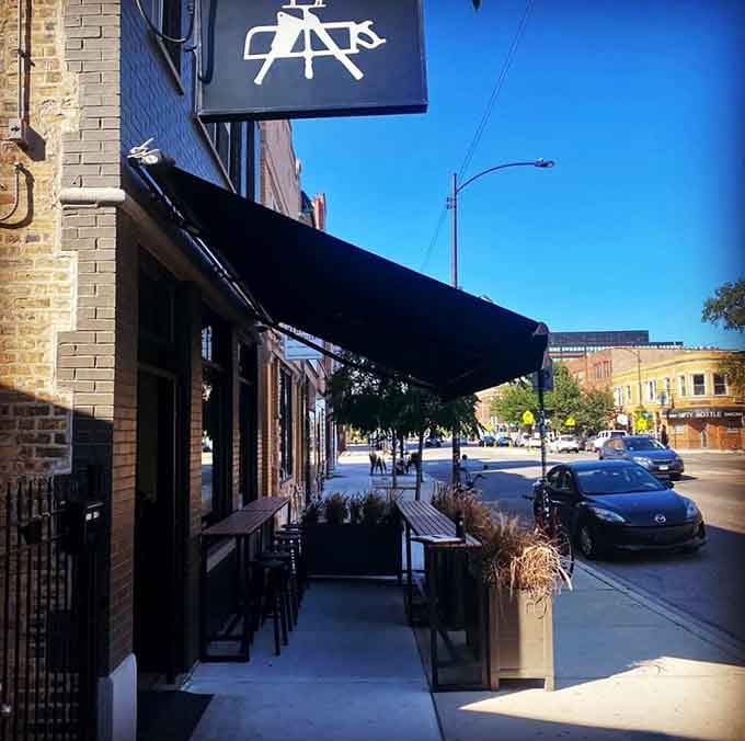 The sleek black awning and sidewalk seating whisper "urban sophistication" while the menu shouts "incredible beef" to passersby.