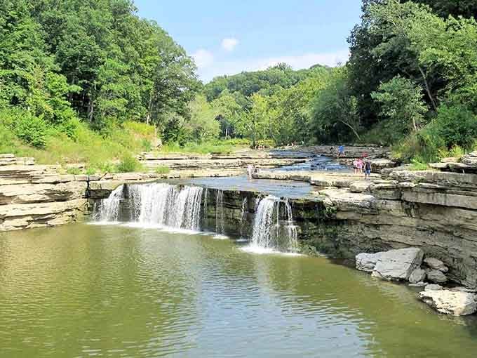 Nature's own stair-step design creates multiple cascades that look like something from a postcard you'd actually want to send.