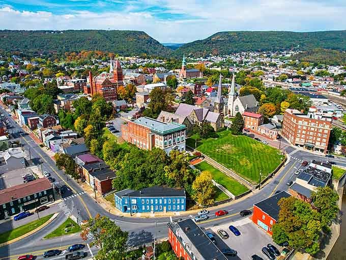 Church steeples and historic buildings nestle between mountain ridges, creating a downtown that Norman Rockwell would have loved to paint.