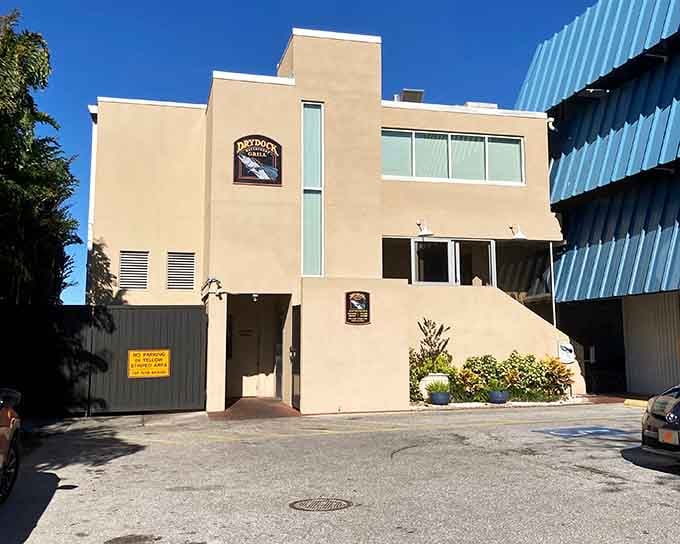 The unassuming exterior hides waterfront magic inside, proving you can't judge a seafood spot by its parking lot.