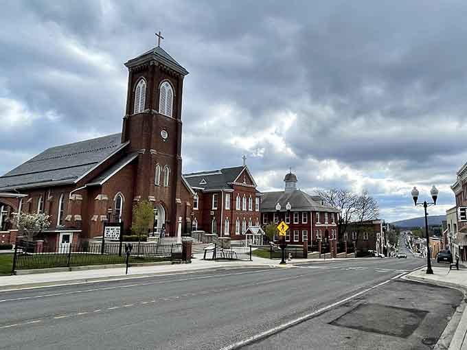 That dramatic church tower anchors the town square where mountain views and community spirit create something truly special together.